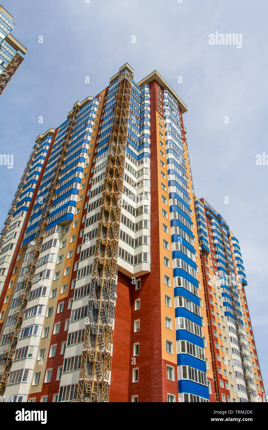Two new blocks of modern apartments with balconies and blue sky in the ...