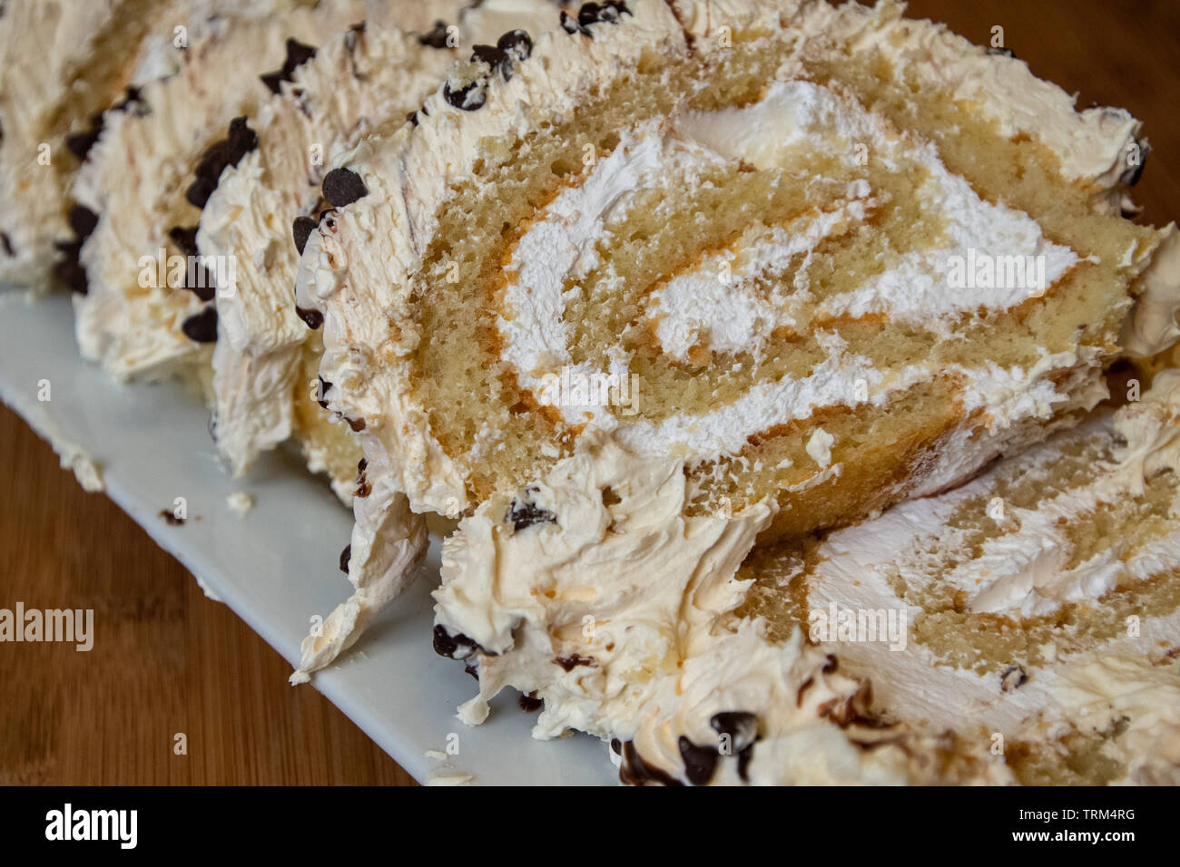 Cream cheese roll cake with chocolate chips Stock Photo - Alamy