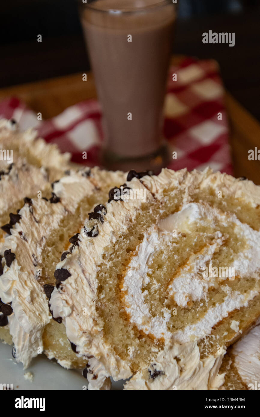 Cream cheese roll cake with chocolate chips Stock Photo - Alamy