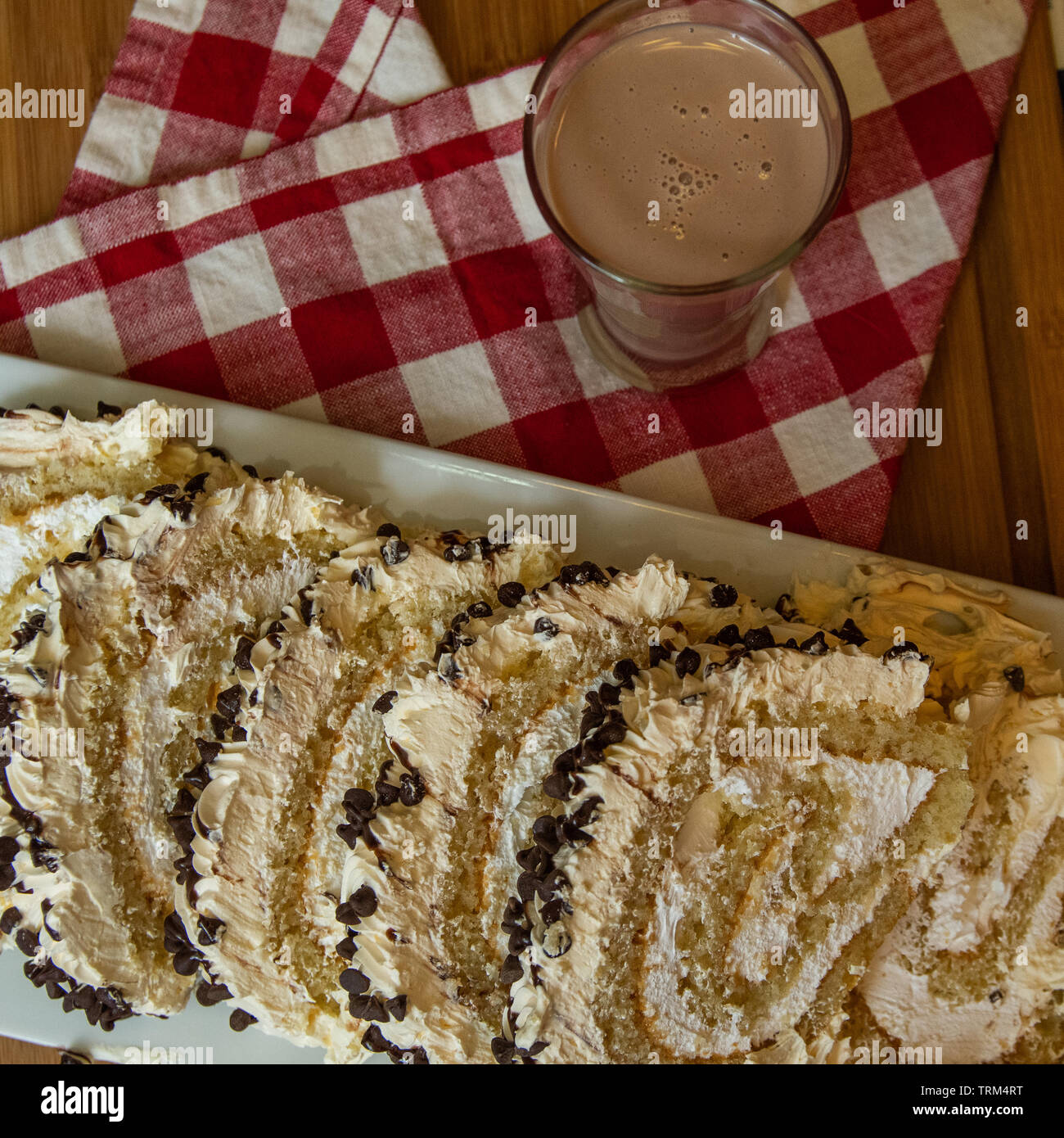 Cream cheese roll cake with chocolate chips Stock Photo - Alamy