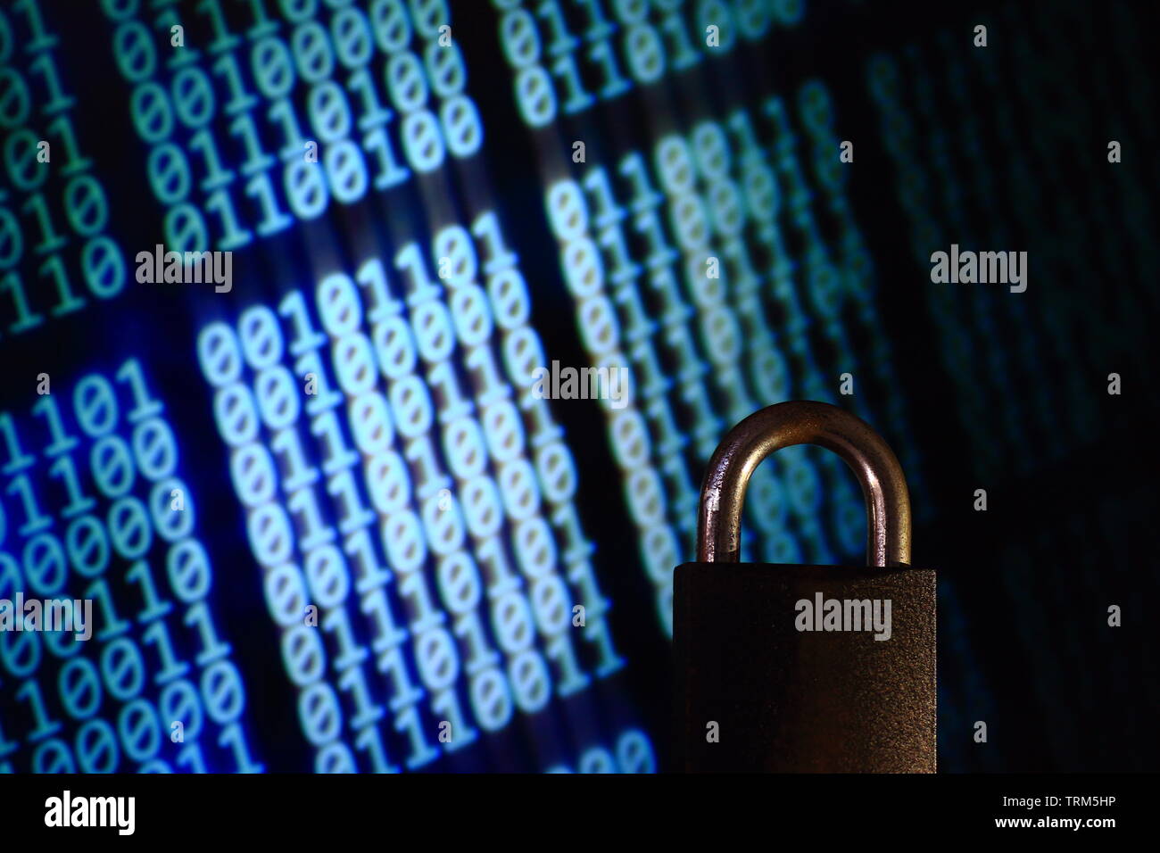 binary computer language matrix blurred be hide an iron Padlock. sign ...