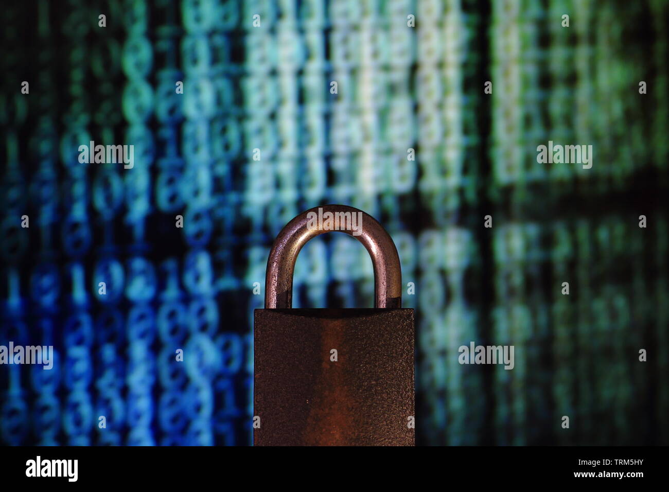 binary computer language matrix blurred be hide an iron Padlock. sign ...