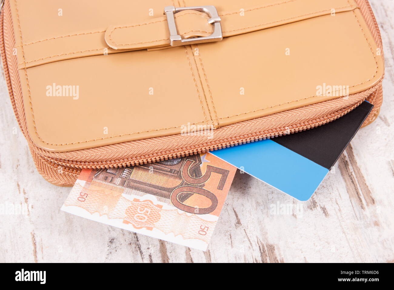 Currencies euro and credit card with leather wallet. Concept of choice ...