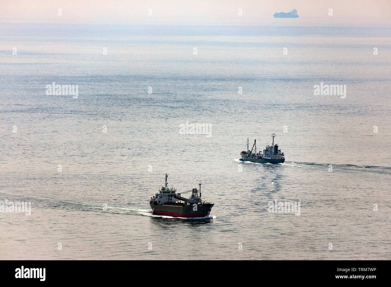 Ships pass in opposite shipping lanes on a bright sunny day Stock Photo ...