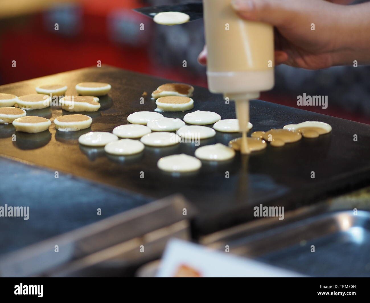 Woman making pastry pancake Stock Photo - Alamy