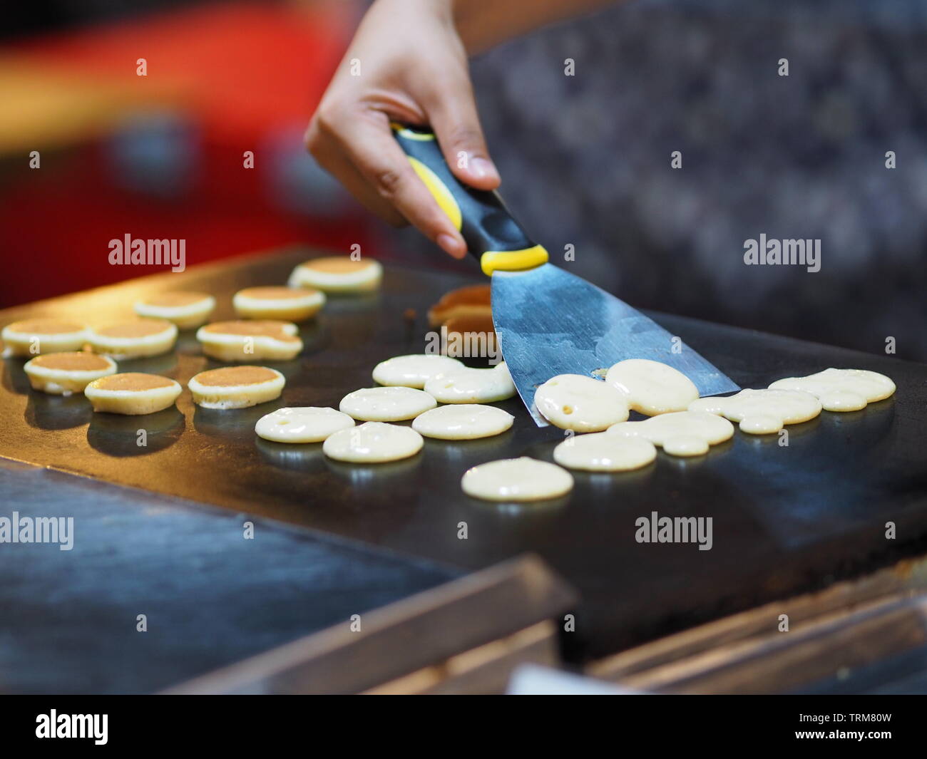 Woman making pastry pancake Stock Photo - Alamy