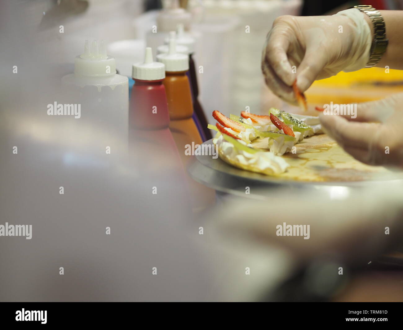 Woman making pastry cape cake Stock Photo - Alamy