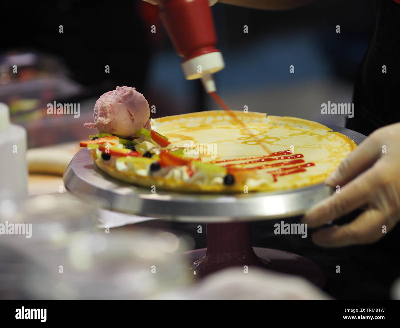 Woman making pastry cape cake Stock Photo - Alamy