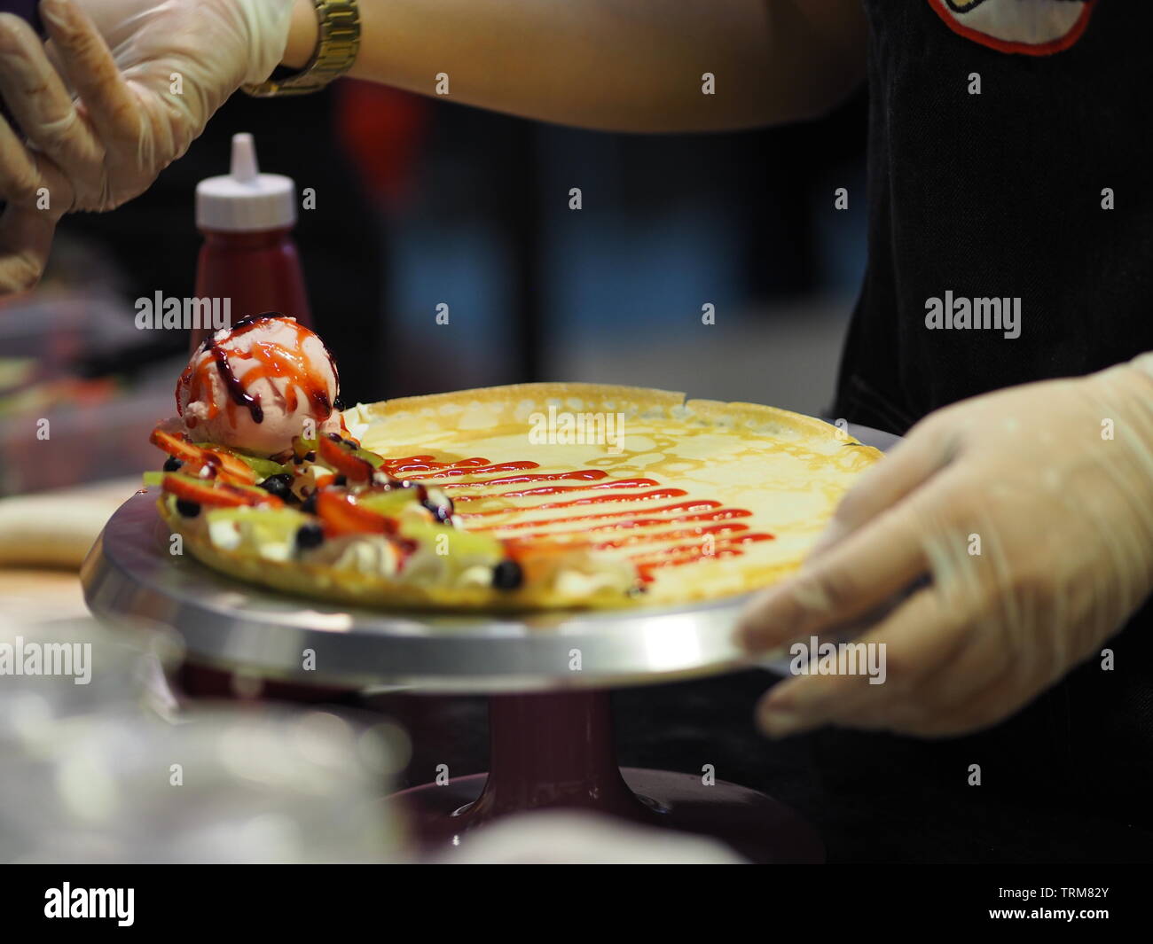 Woman making pastry cape cake Stock Photo - Alamy
