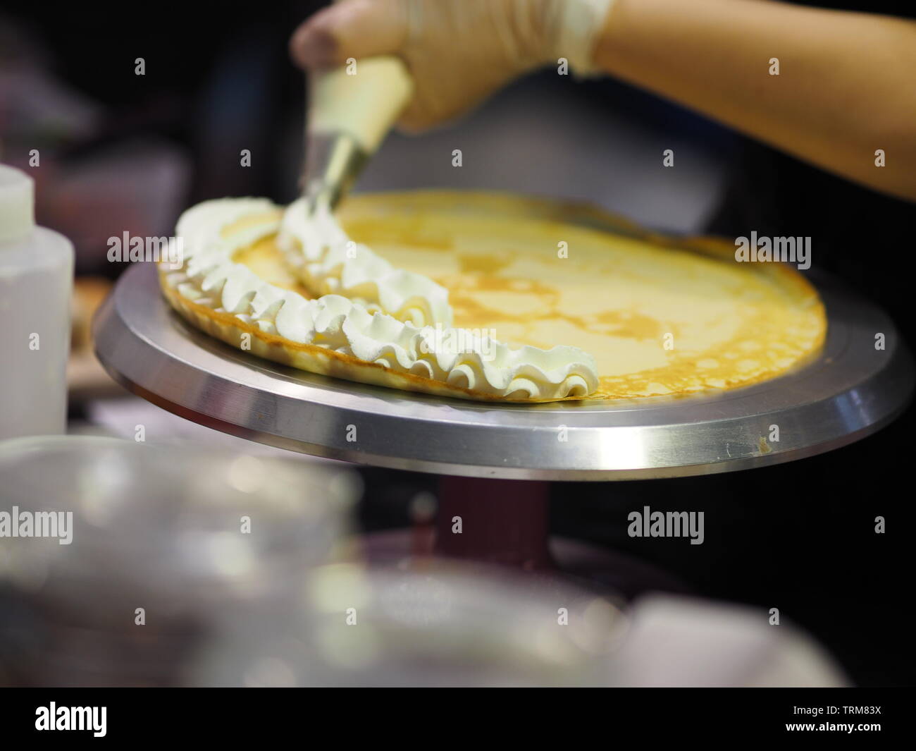 Woman making pastry cape cake Stock Photo - Alamy