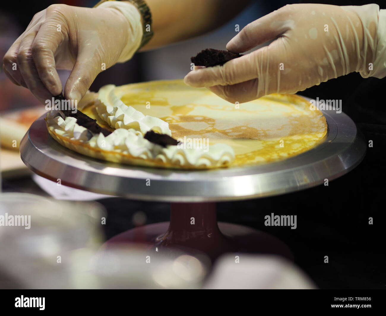 Woman making pastry cape cake Stock Photo - Alamy