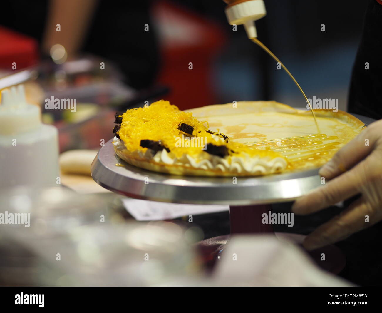 Woman making pastry cape cake Stock Photo - Alamy