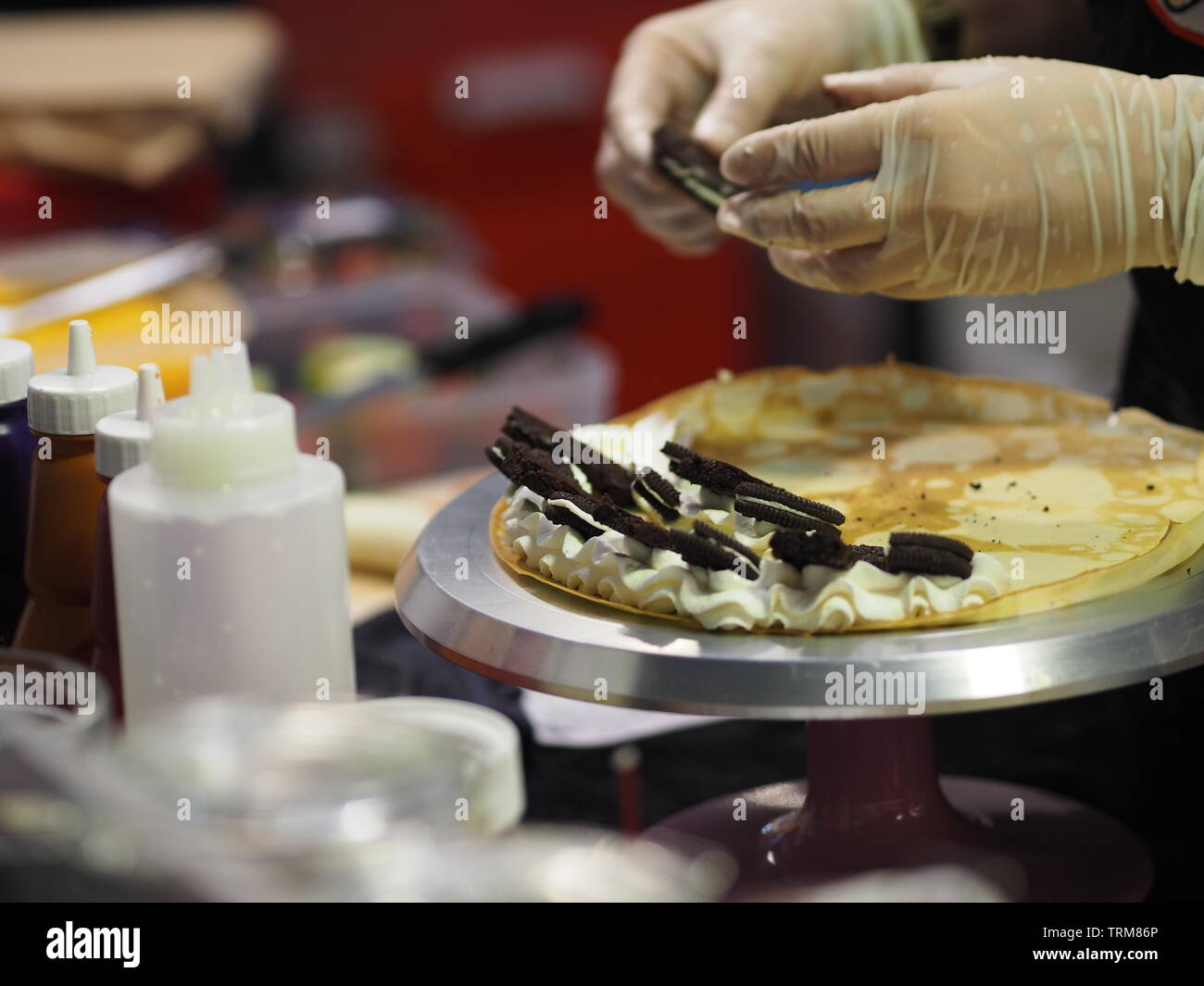 Woman making pastry cape cake Stock Photo - Alamy