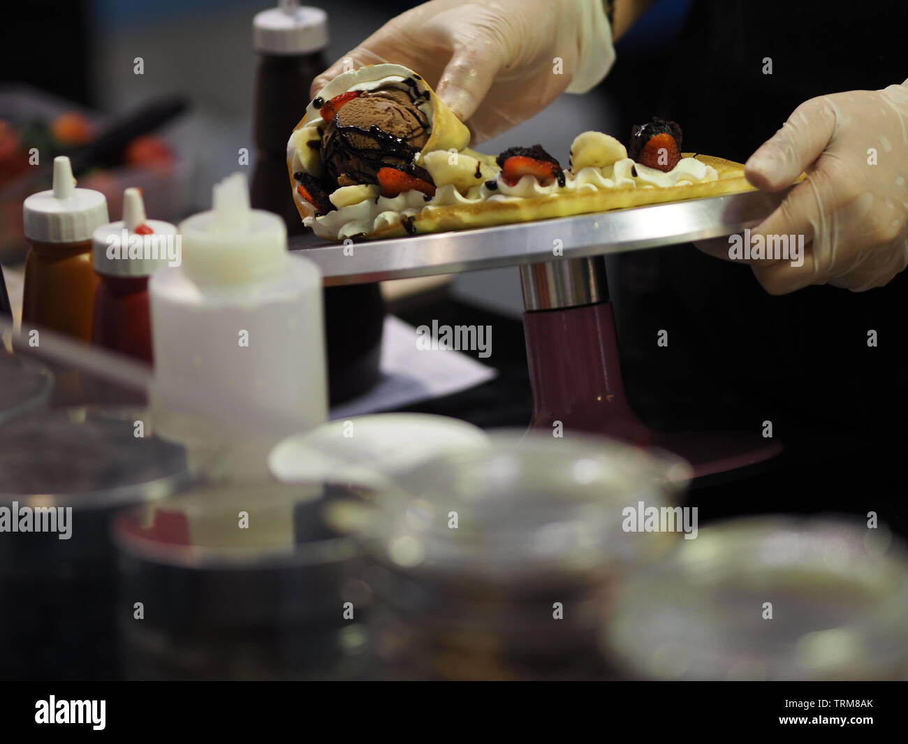 Woman making pastry cape cake Stock Photo - Alamy