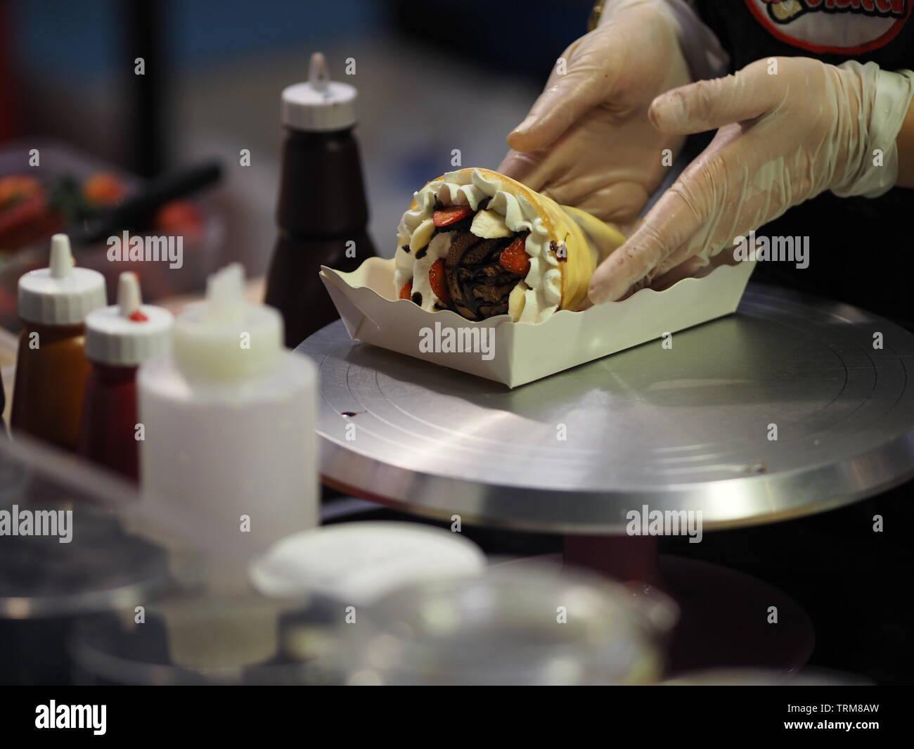 Woman making pastry cape cake Stock Photo - Alamy