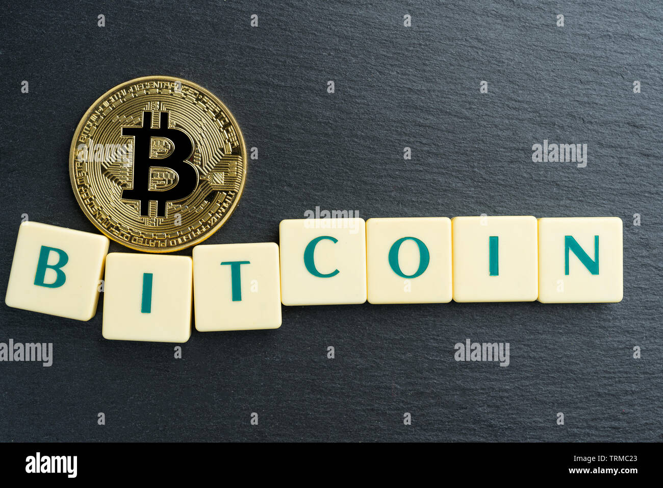 Physical Bitcoin gold coin with text made out of letter tiles ...