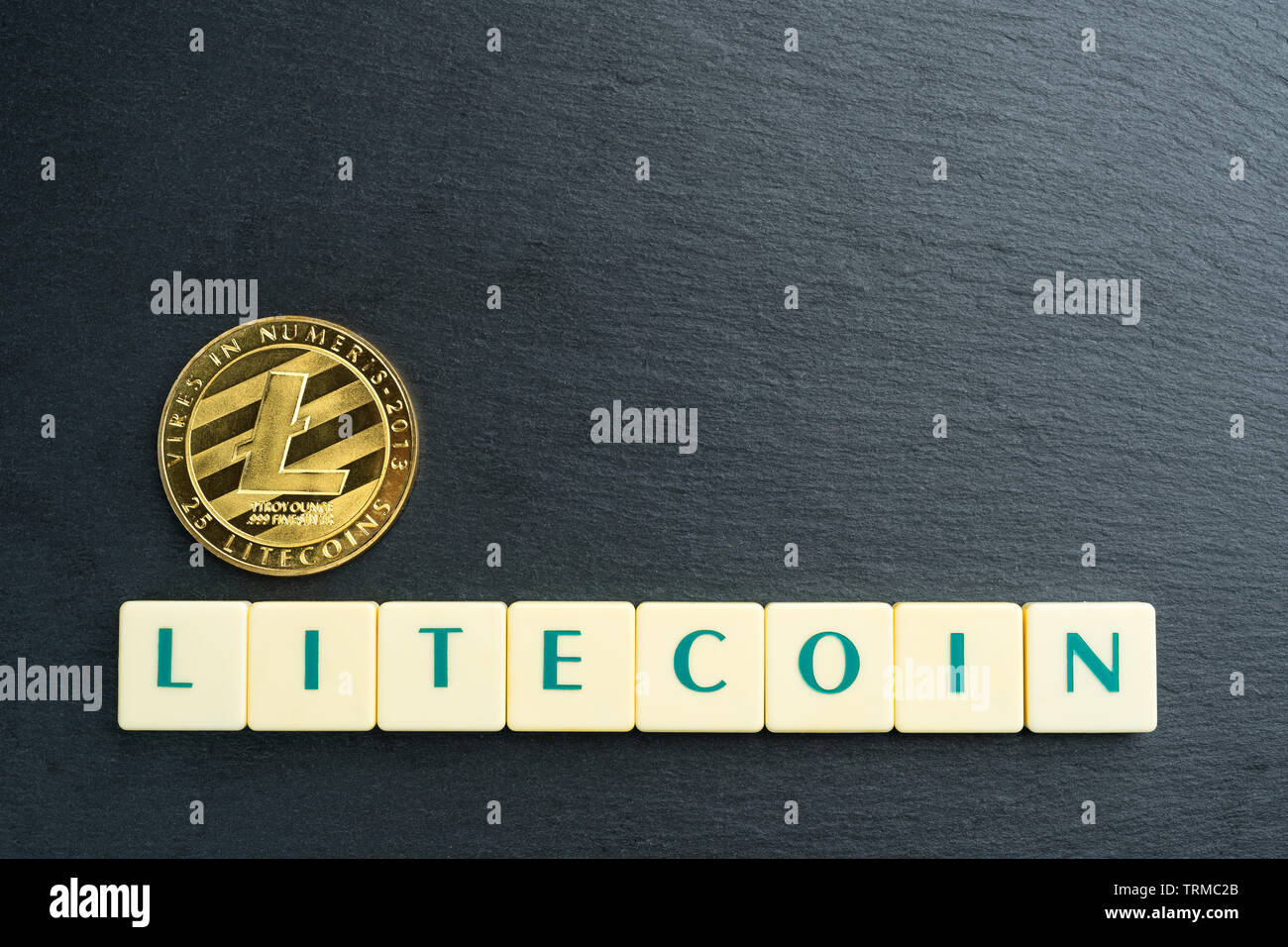 Physical Litecoin gold coin with text made out of letter tiles ...