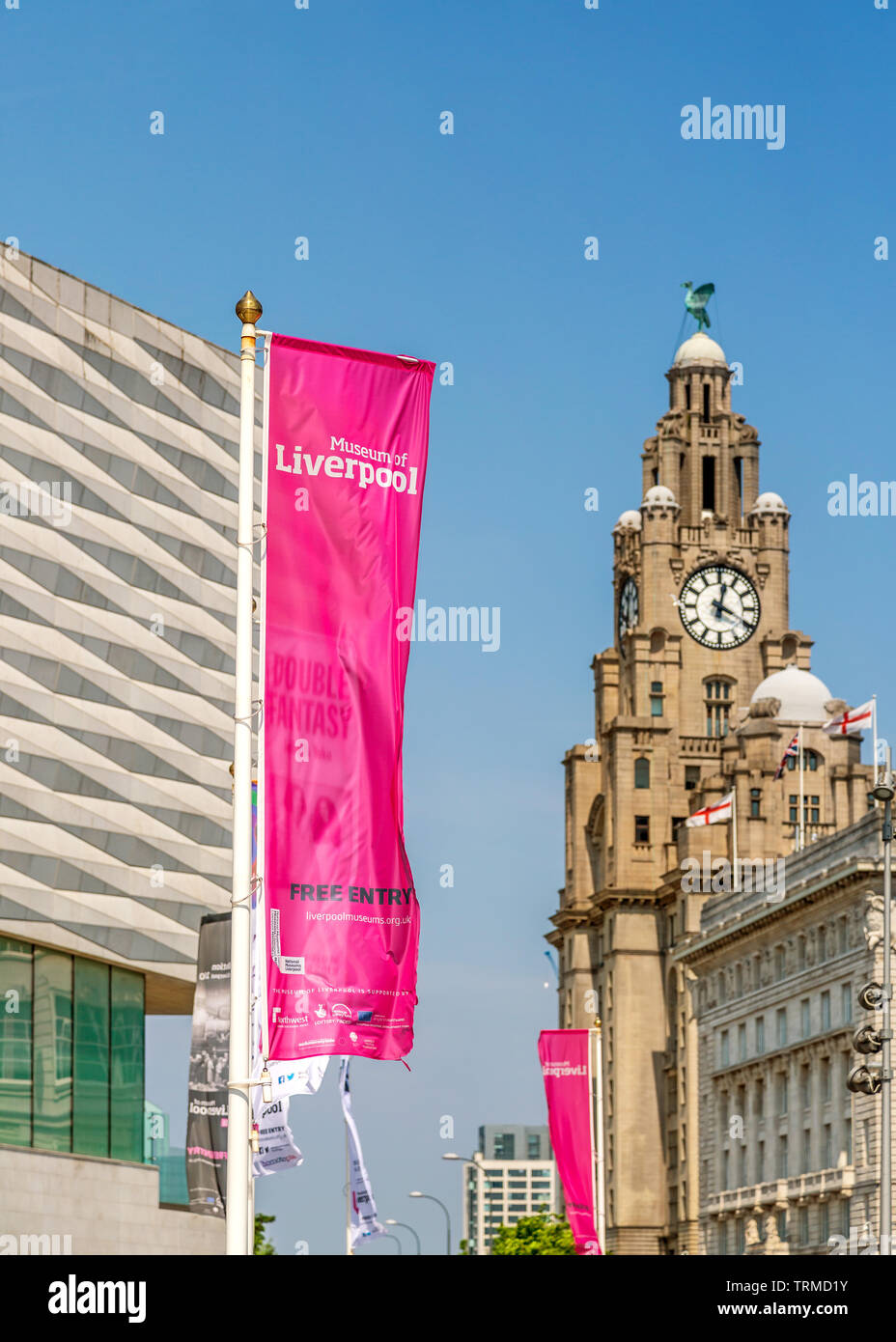 Flag on Liverpool Museum with Liver Building close by Stock Photo - Alamy