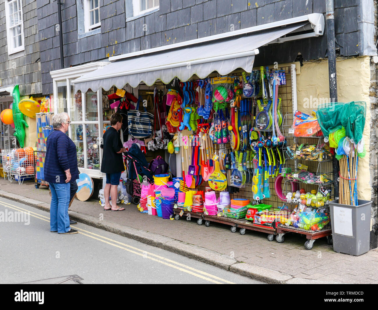 A colourful display of seaside games and toys outside a gift shop Stock ...