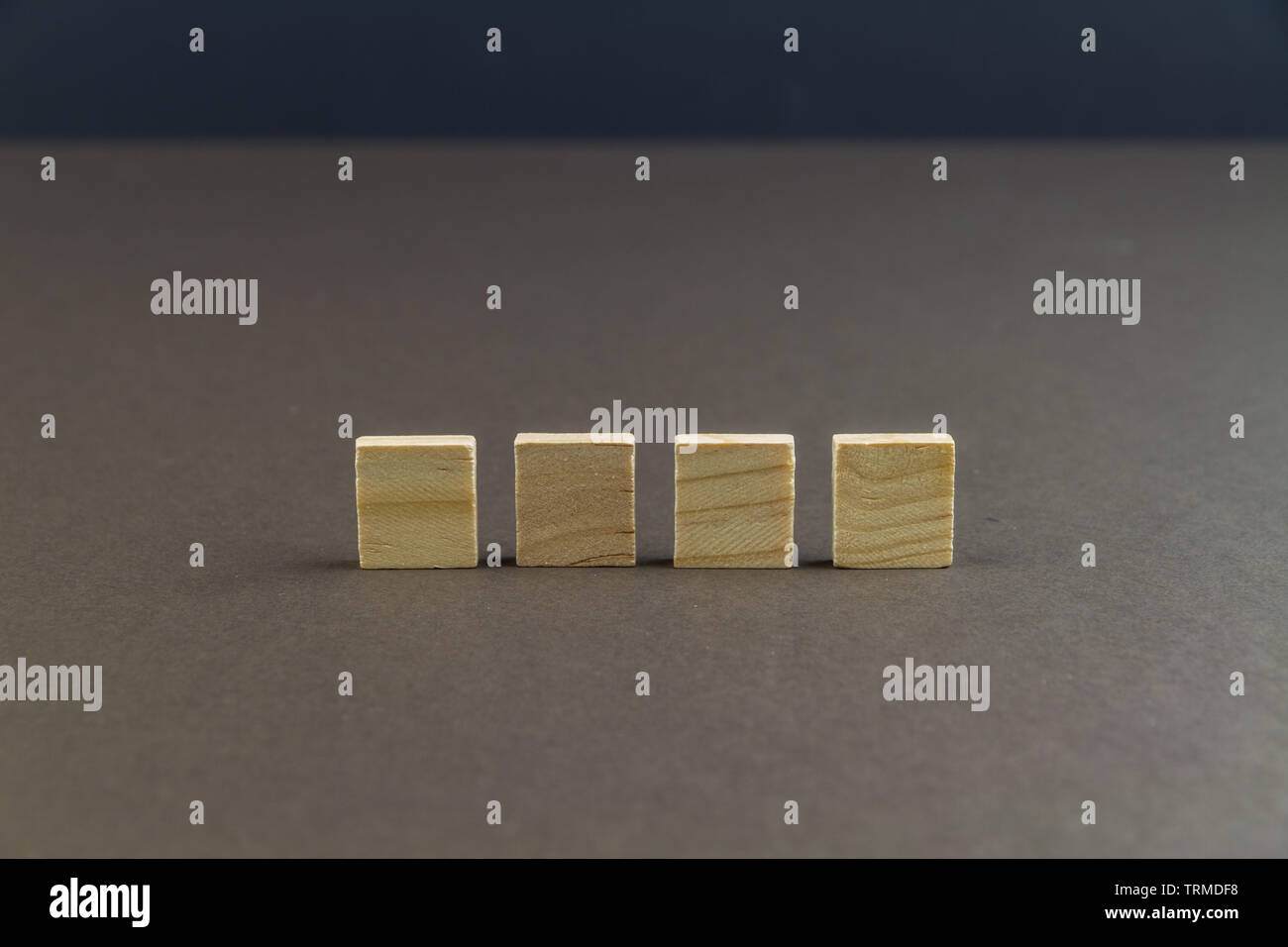 Four wood blocks against dark background, graphic resource, template ...