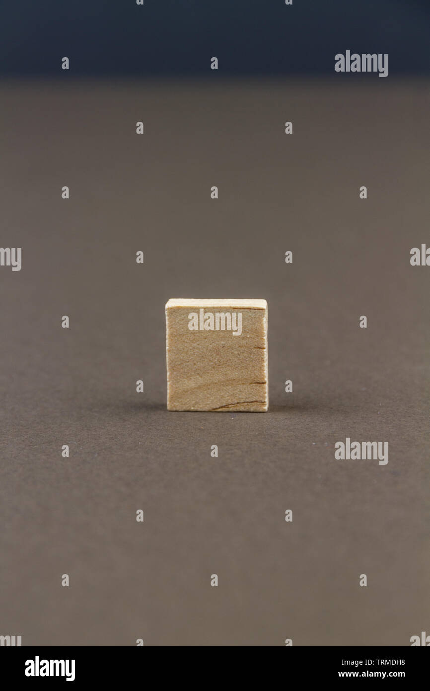 One wood blocks against dark background, graphic resource, template ...