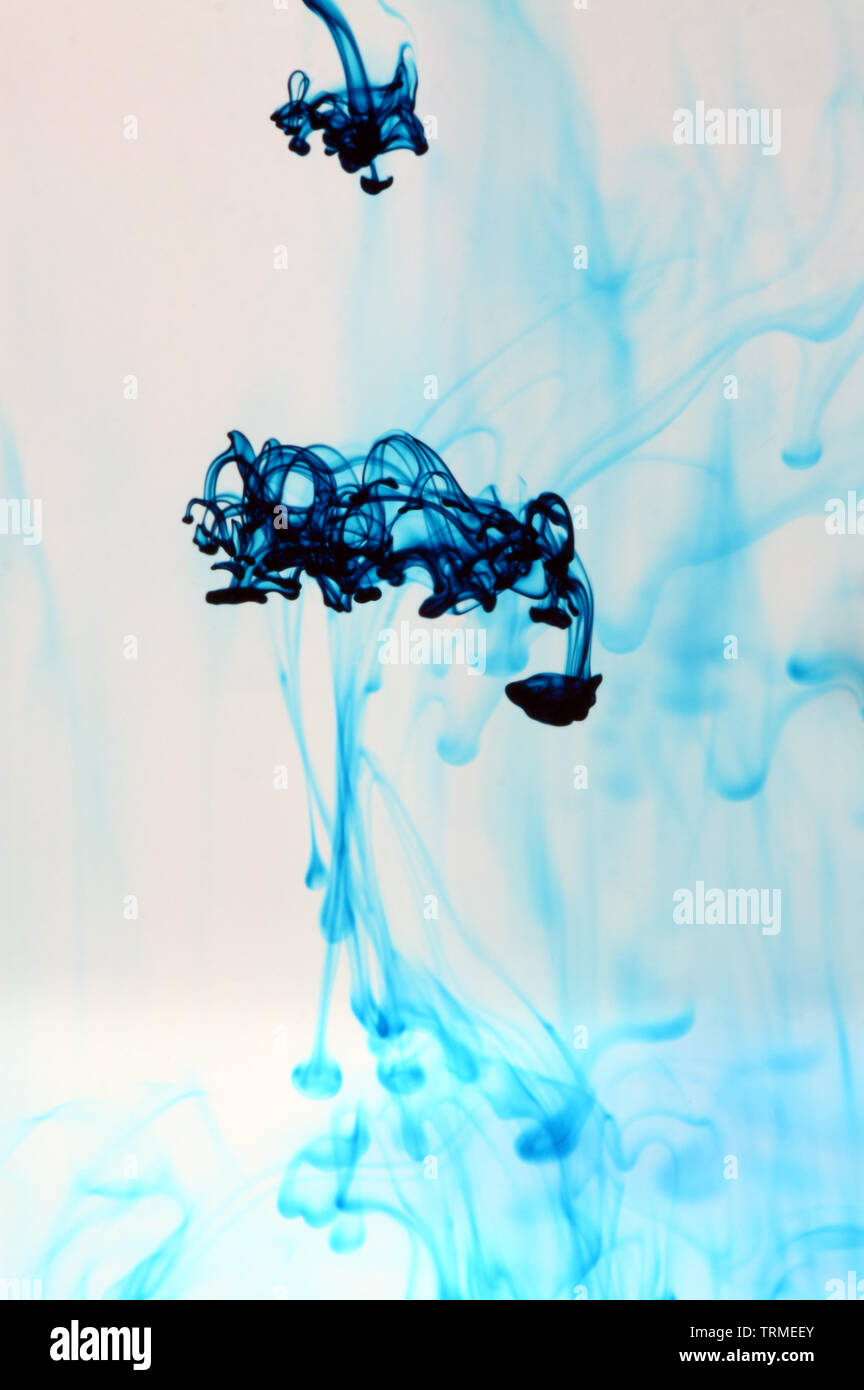 Coloured ink swirling in water Stock Photo - Alamy