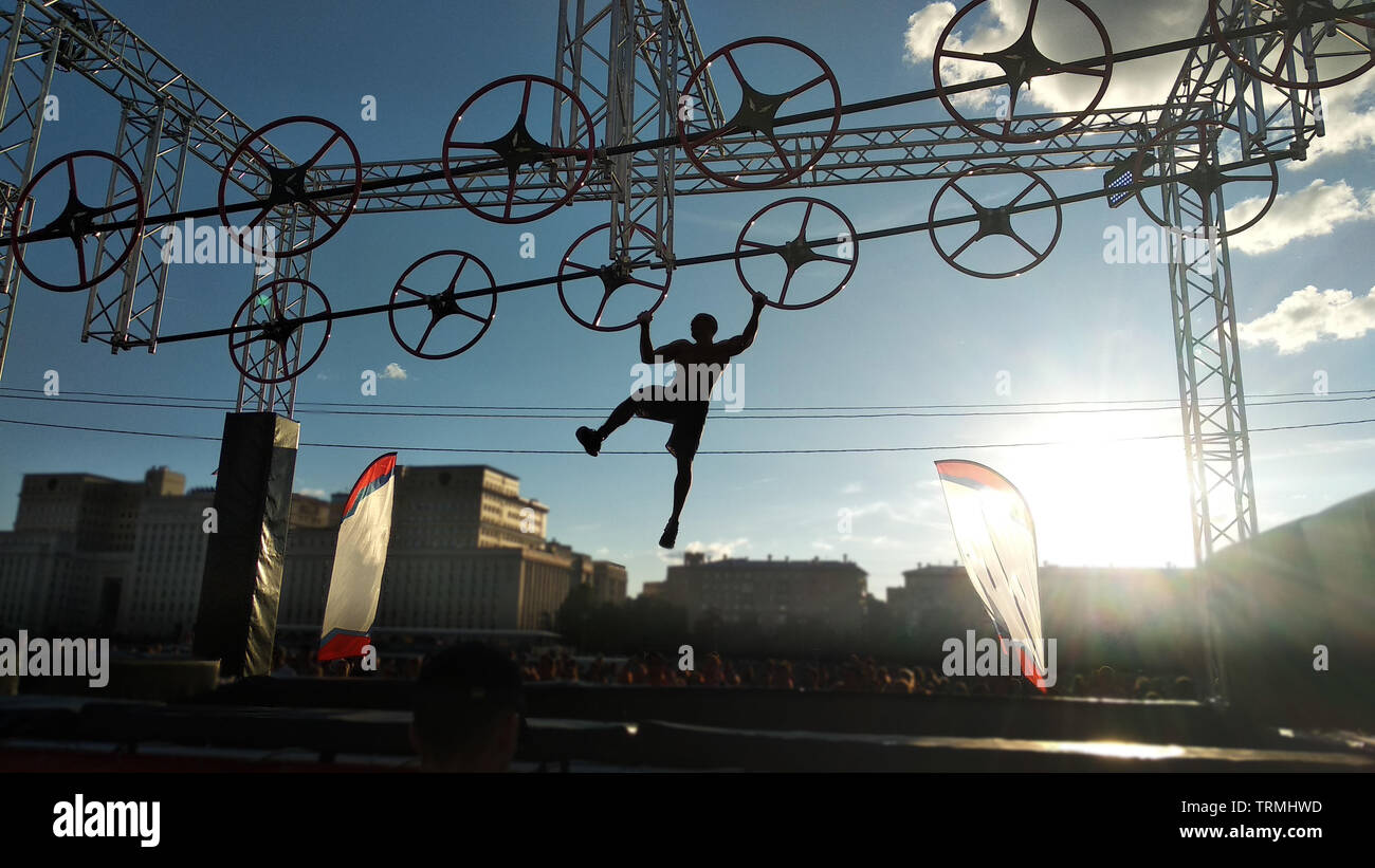 Wipeout show game. Obstacle course. Man power concept Stock Photo - Alamy