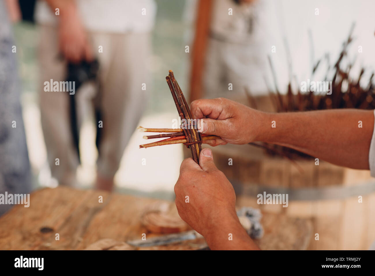 Master man weaves a basket of twigs Stock Photo - Alamy