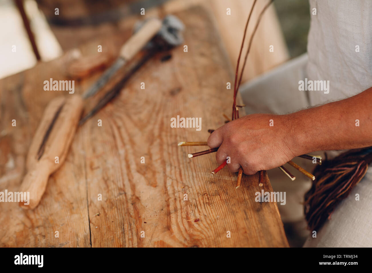 Master man weaves a basket of twigs Stock Photo - Alamy
