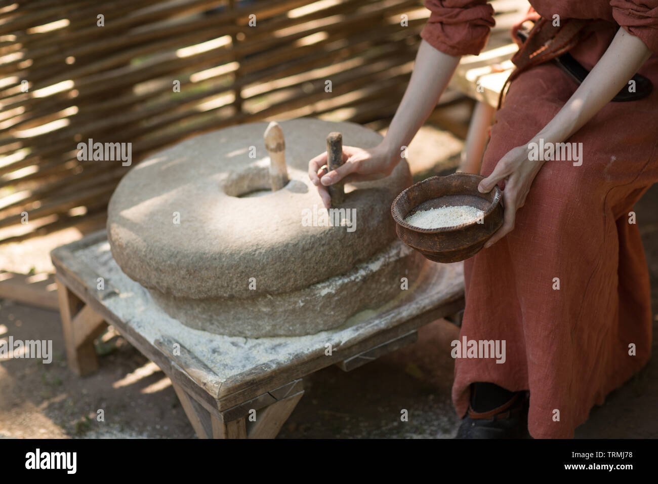 Grinding grain, quern stone hi-res stock photography and images - Alamy