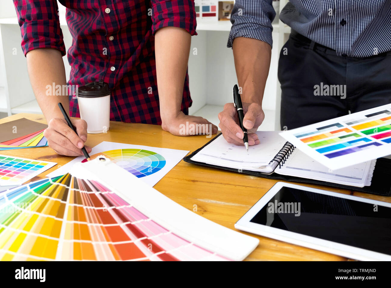 Graphic designers choose colors from the color bands samples for design ...
