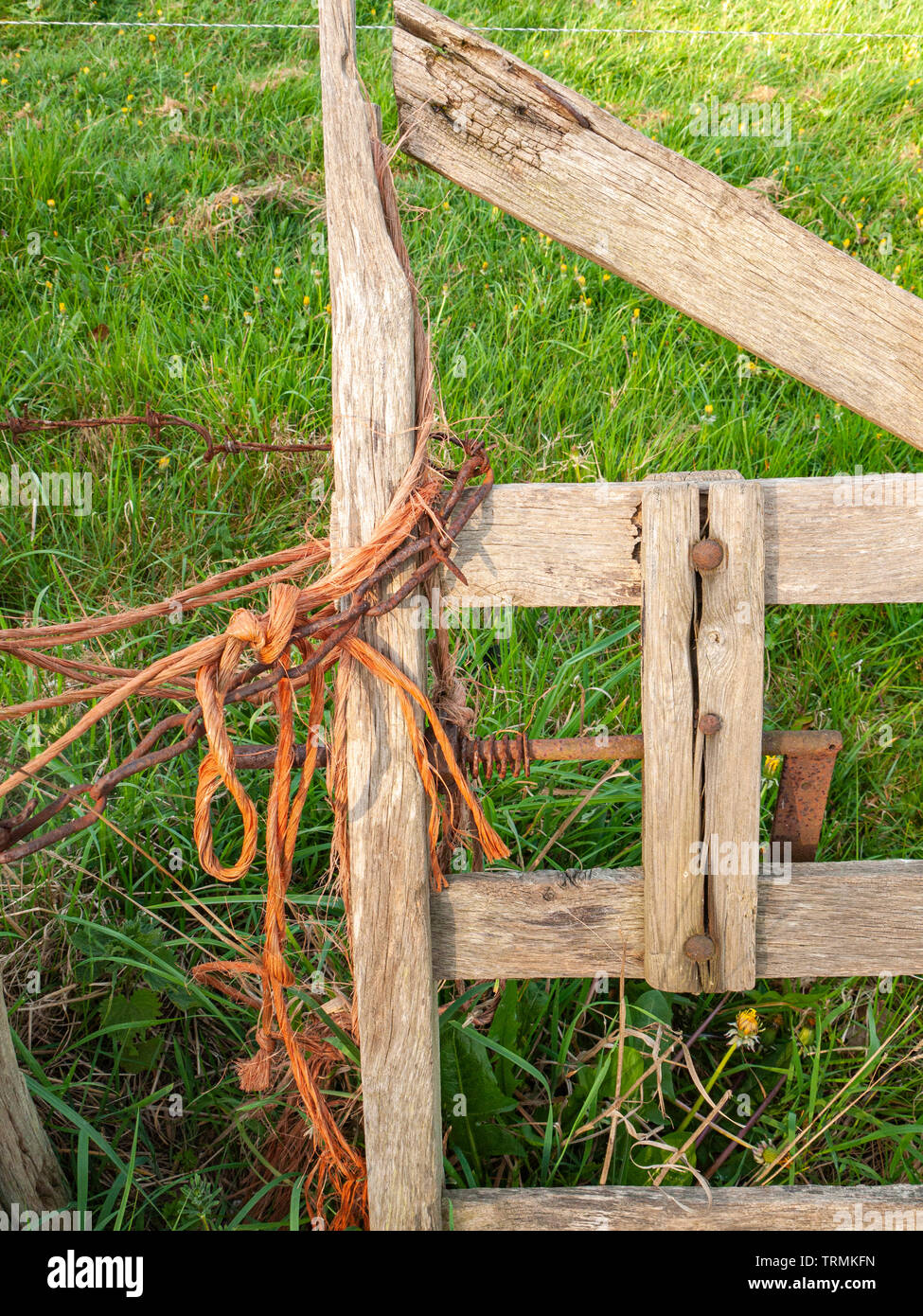 Detail of old wooden gate locket with orange twine and chain Stock ...