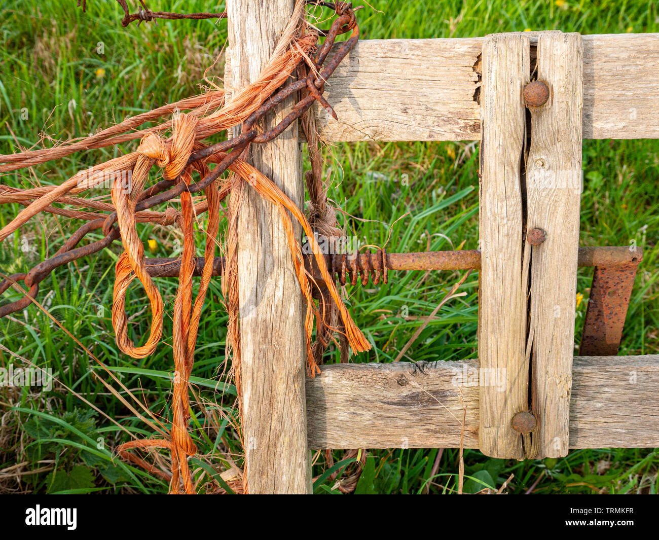 Detail of old wooden gate locket with orange twine and chain Stock ...