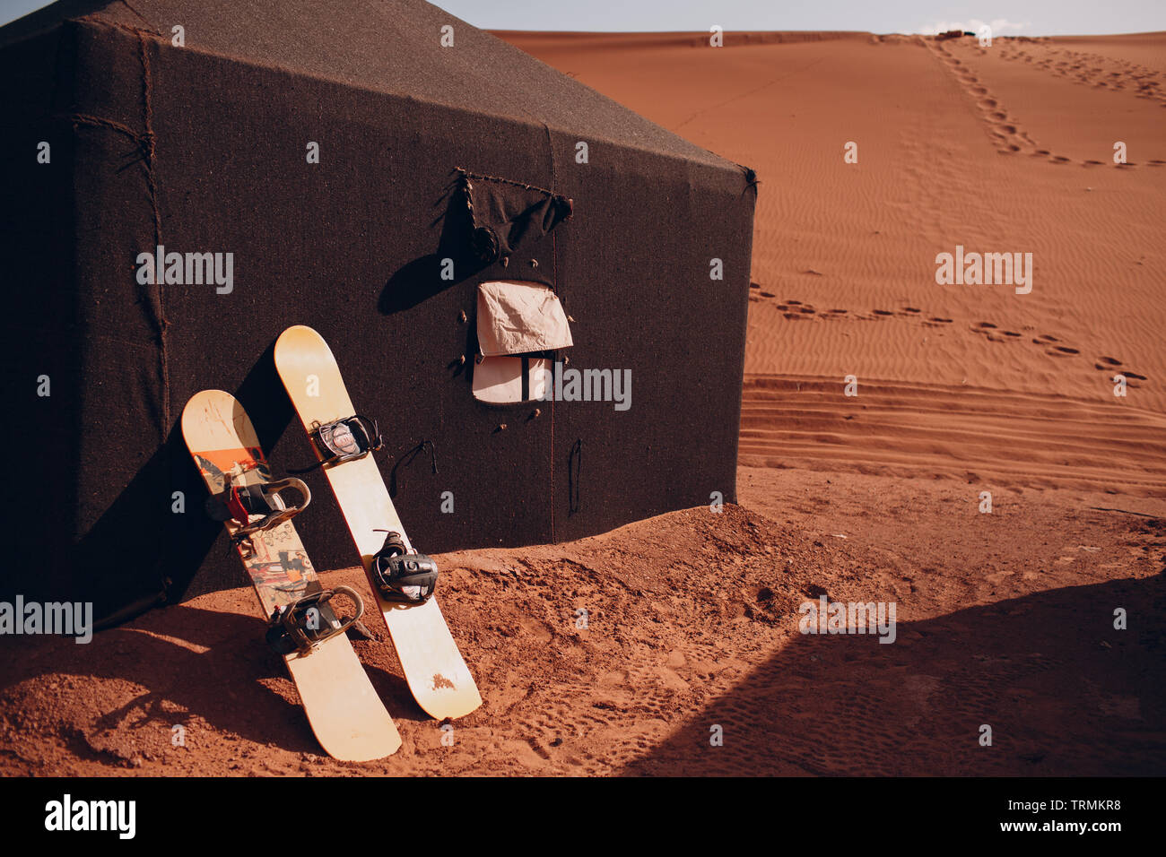 Snowboard in the desert. Vacation and activity concept Stock Photo - Alamy