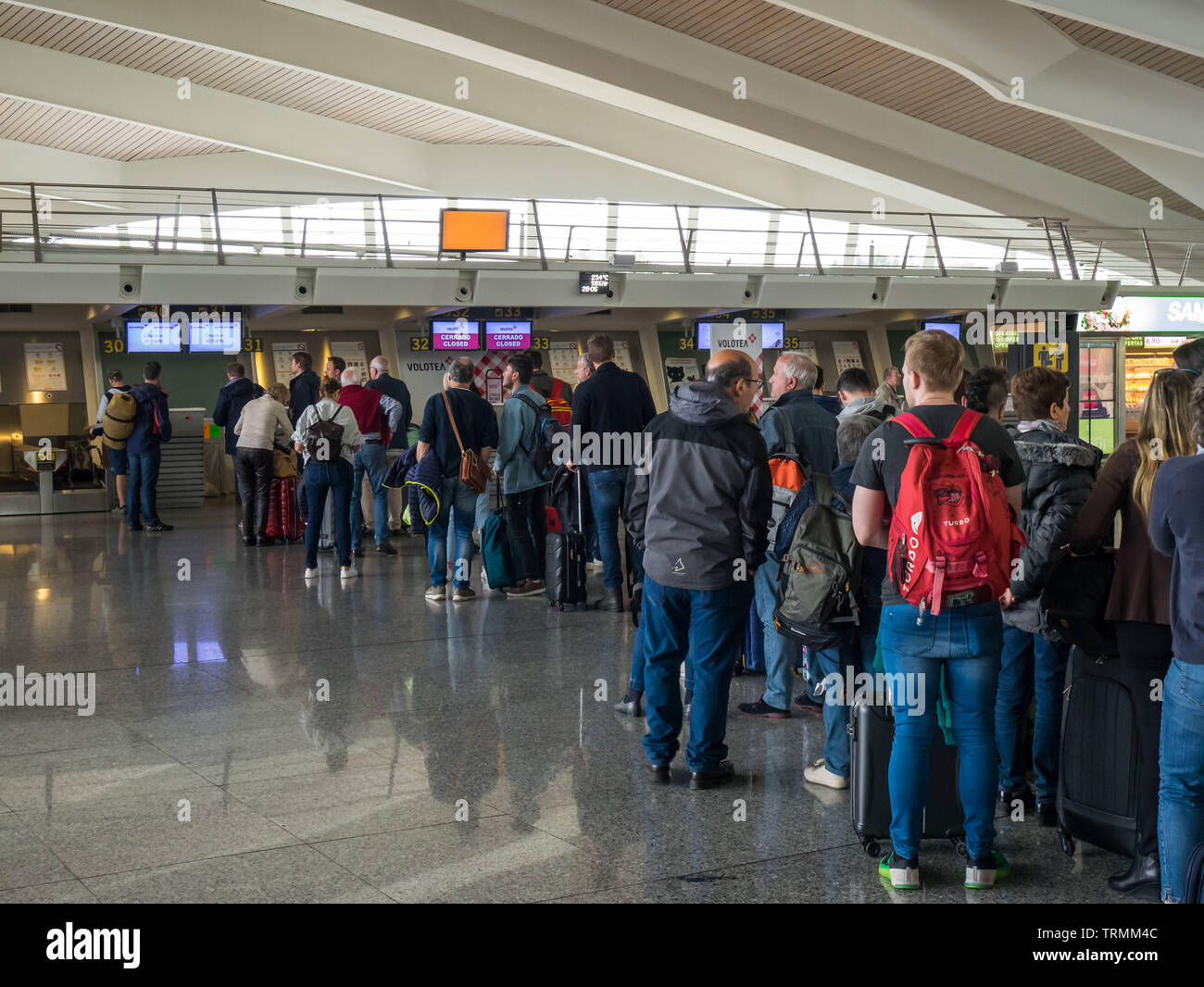 Long queue at the check in counter of a Eurowings flight, Bilbao ...
