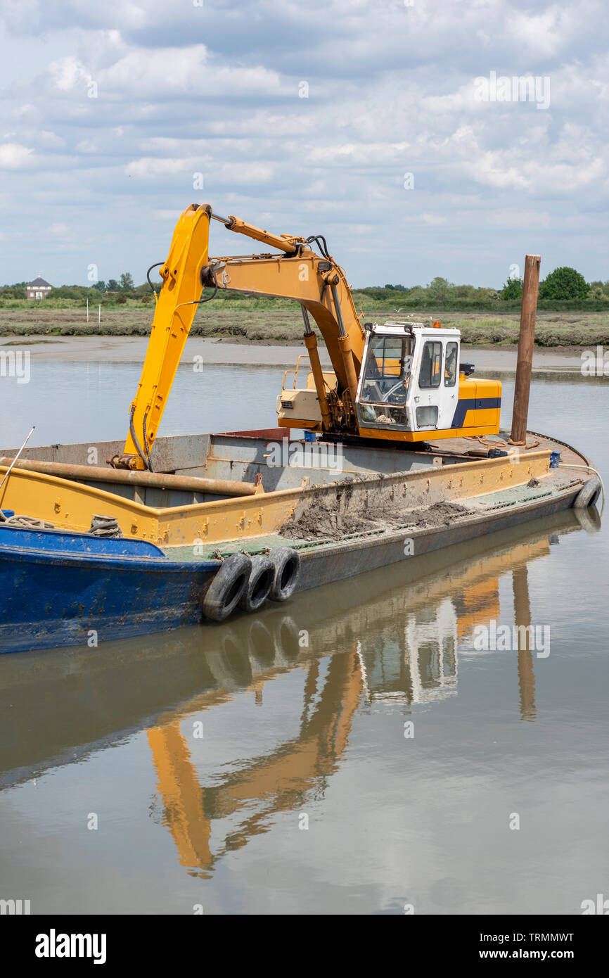 Large yellow crane on a small barge Stock Photo - Alamy