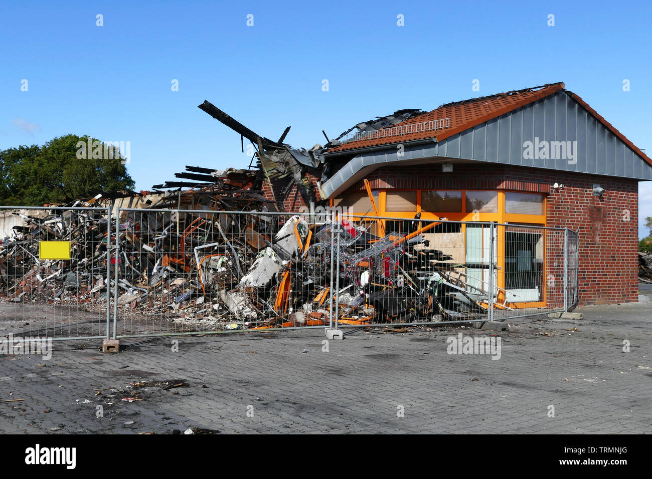 View of a deserted run down building after a fire Stock Photo - Alamy