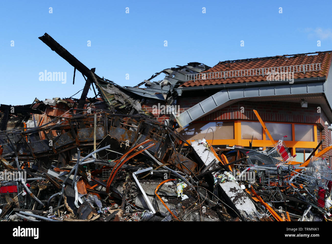 View of a deserted run down building after a fire Stock Photo - Alamy