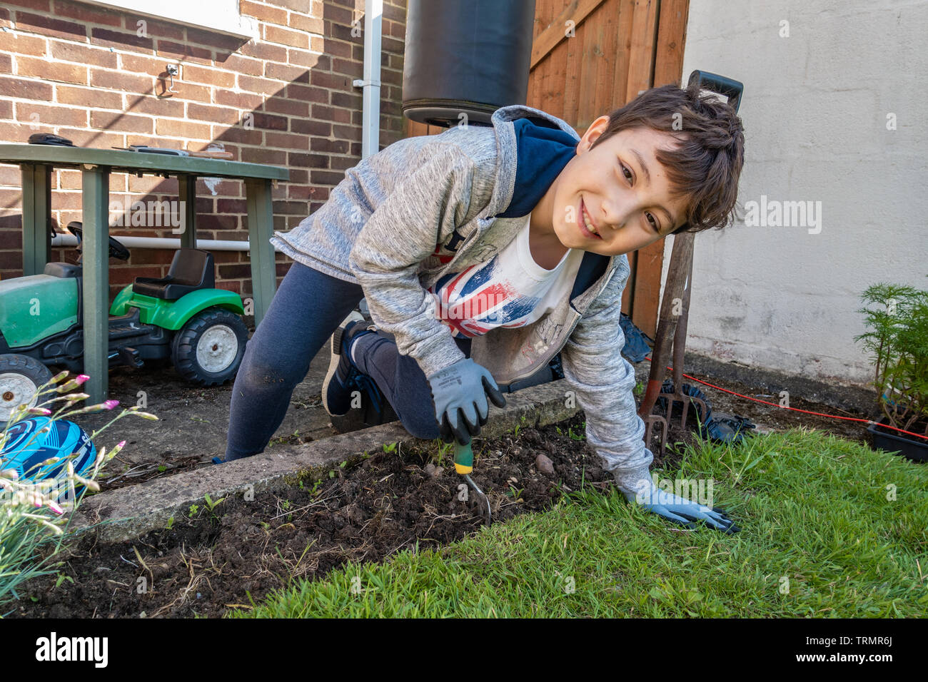Boy gardening soil hi-res stock photography and images - Alamy