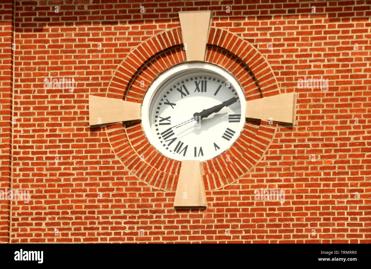 Brick wall with clock hi-res stock photography and images - Alamy
