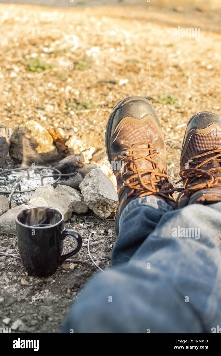Preparing coffee with bonfire, resting during a camp in nature. First ...