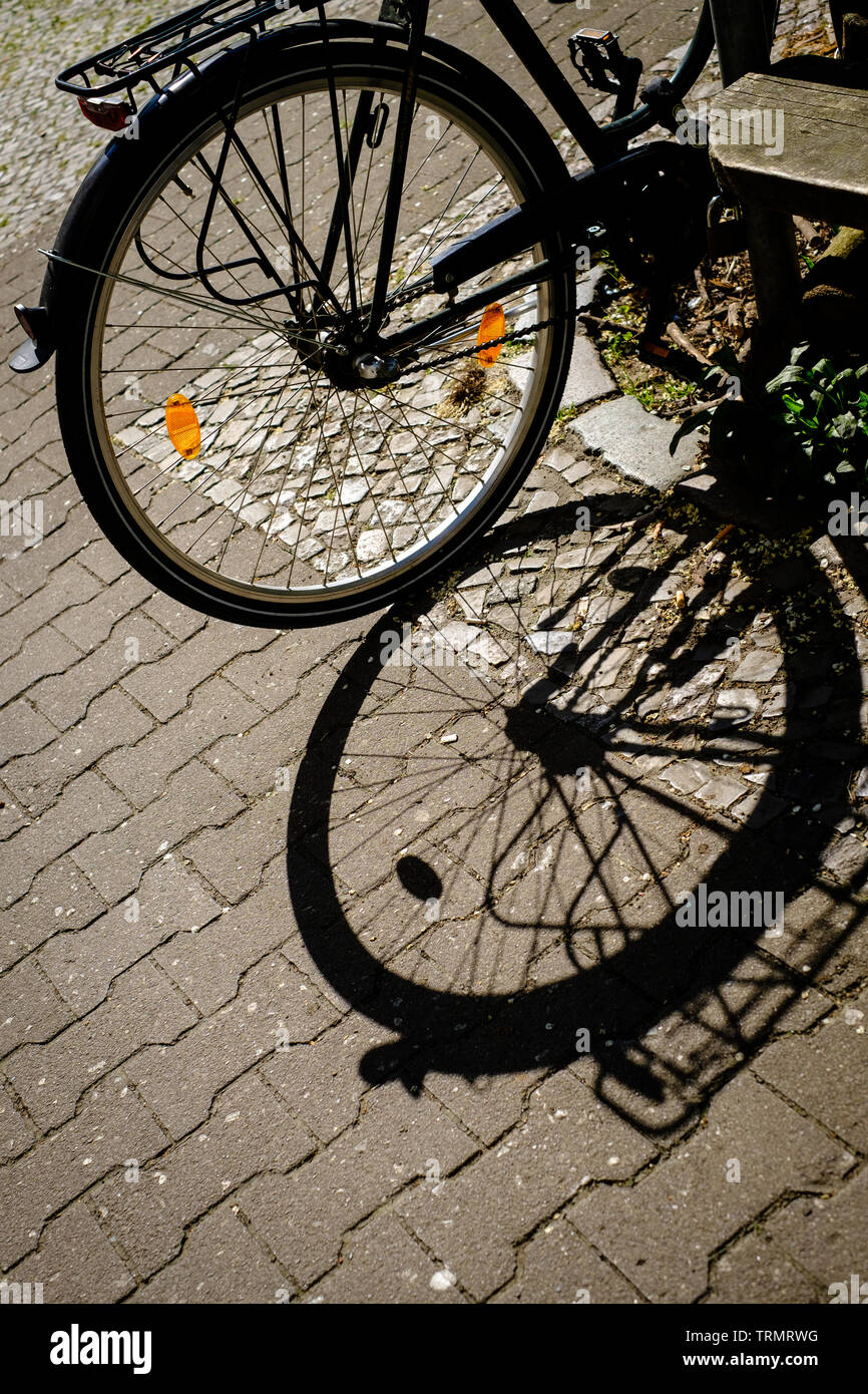 A bicycle wheel and shadow Stock Photo - Alamy