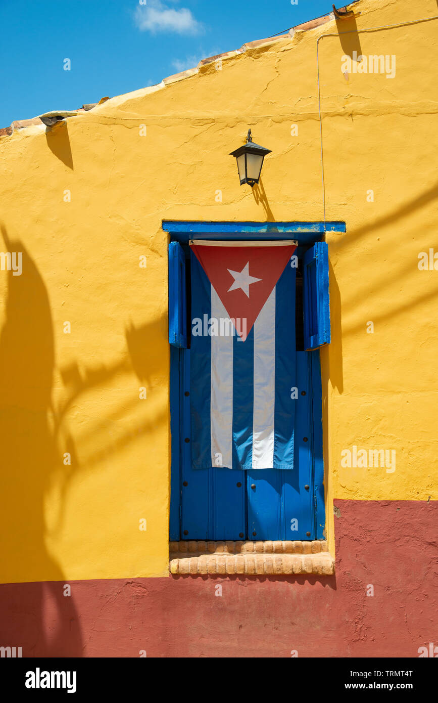 Cuban flag hung outside a house in a street around Plaza Mayor in the ...
