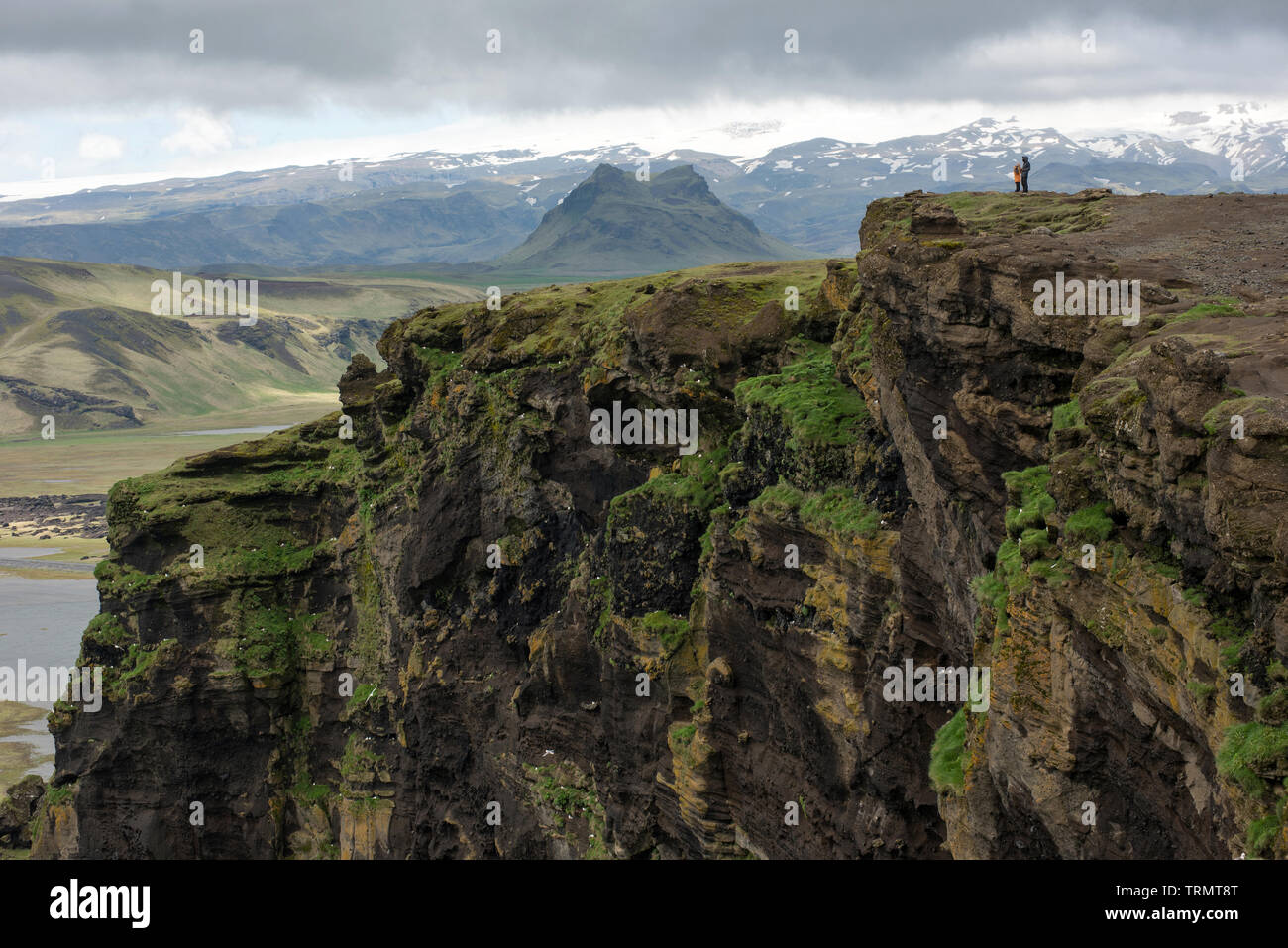 Icelandic landscape with volcanic lava ridge, glacier mountains, green ...