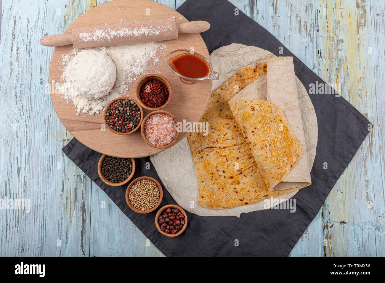 Cooking traditional Turkish Yufka ( pastries, pancake) on the stove ...