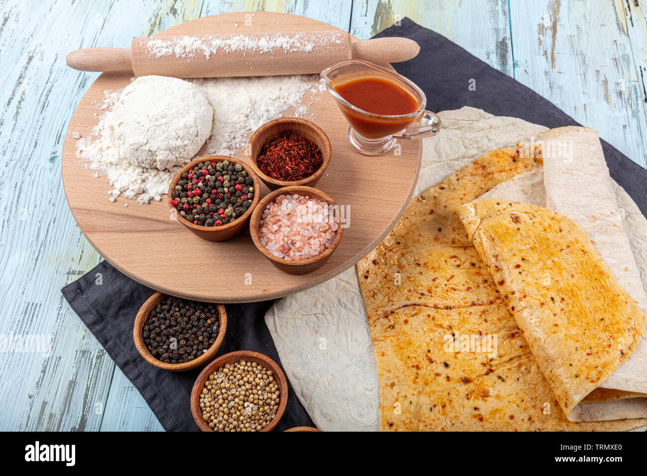 Cooking traditional Turkish Yufka ( pastries, pancake) on the stove ...