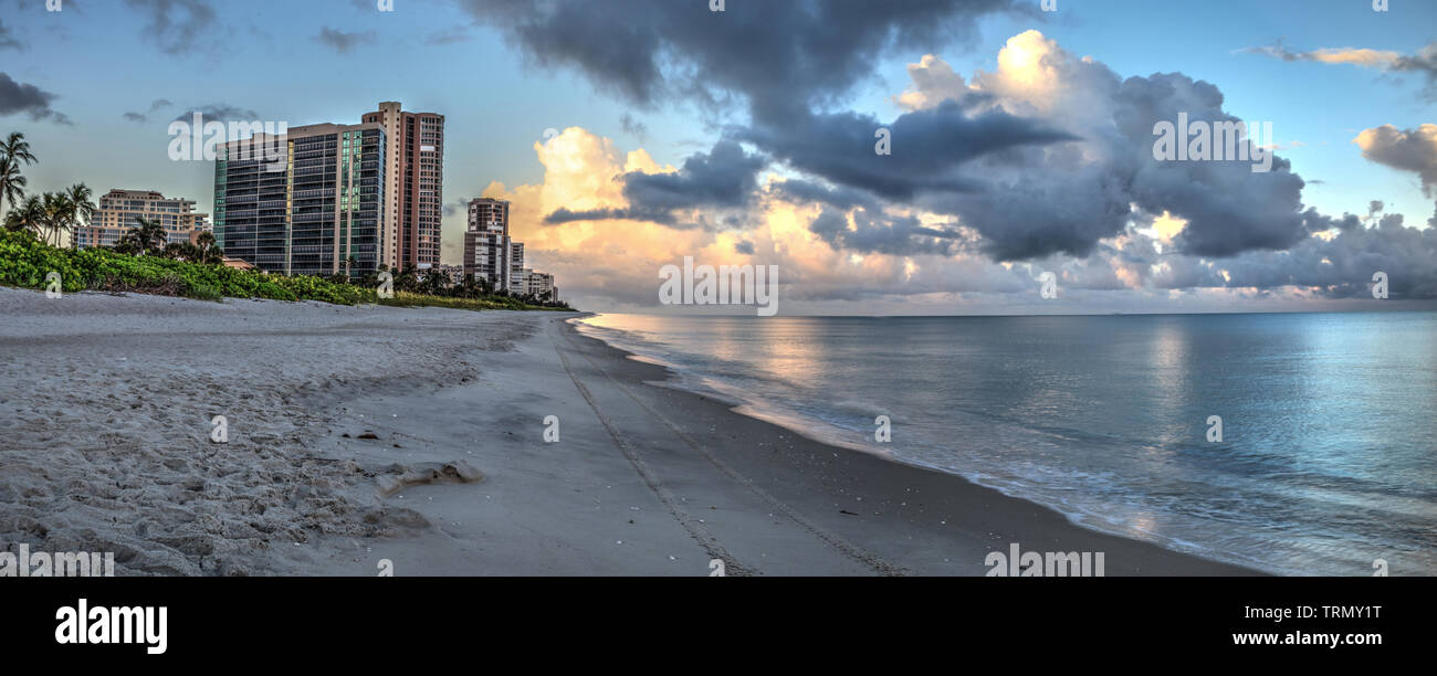 High rise buildings in the distance on North Naples Beach at sunrise in ...