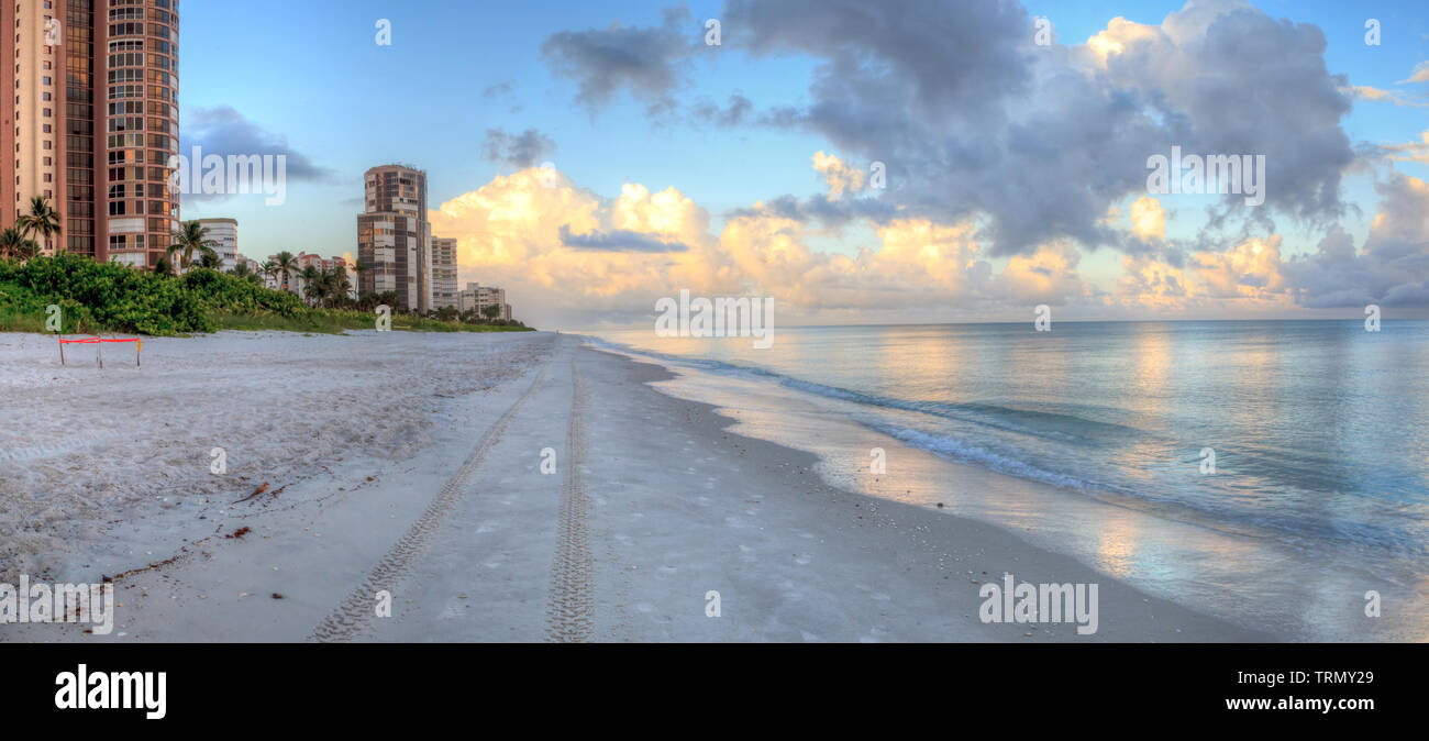 High rise buildings in the distance on North Naples Beach at sunrise in ...