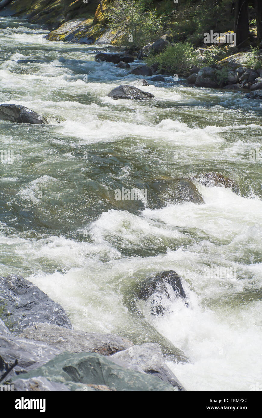 Flowing River in Mountain Range Stock Photo - Alamy