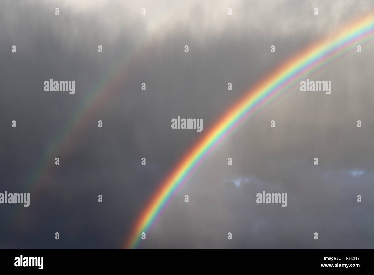 Stunning natural double rainbows plus supernumerary bows seen at a lake ...